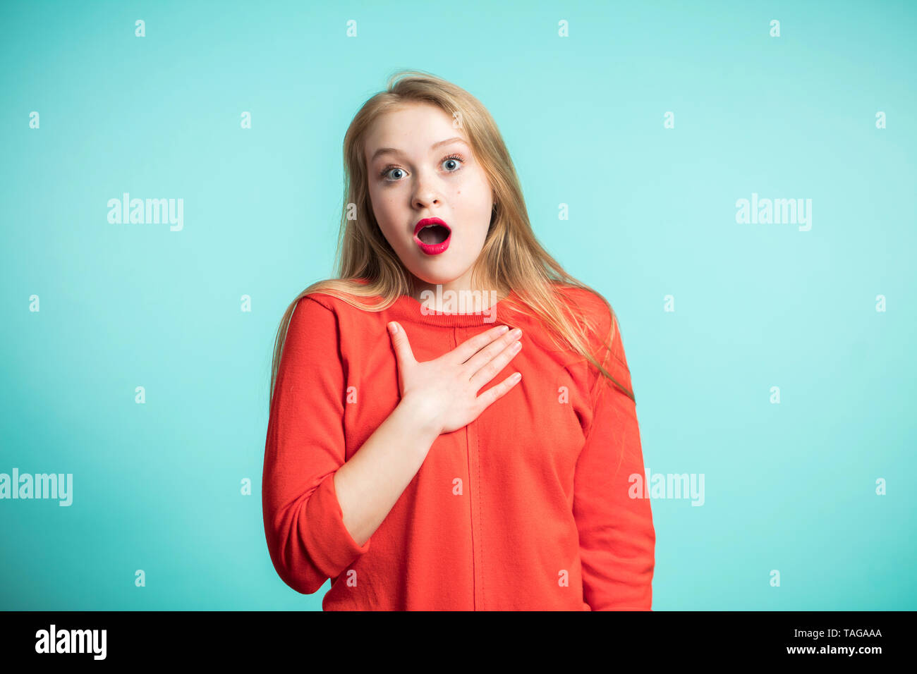 Woman with red lips surprise. Beautiful girl shocked looks on you ...