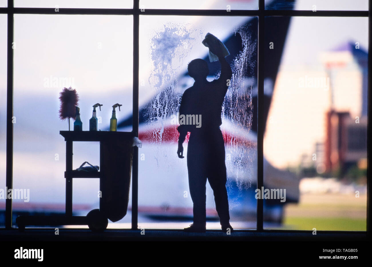 A maintainance worker cleans windows at the Hartsfield Jackson ...