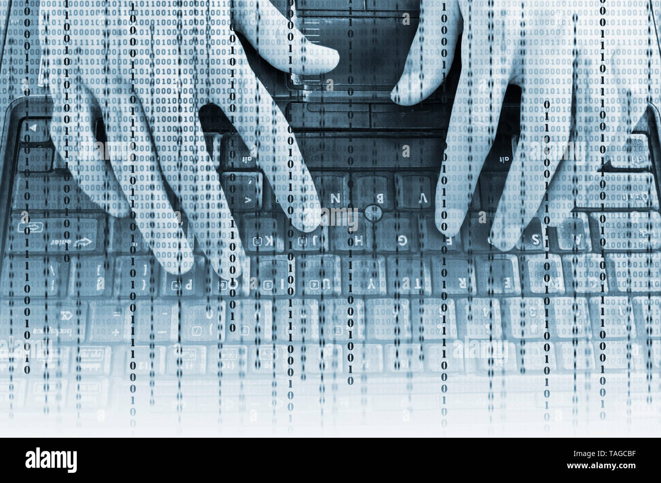 Closeup of hands on laptop keyboard in binary data Stock Photo - Alamy