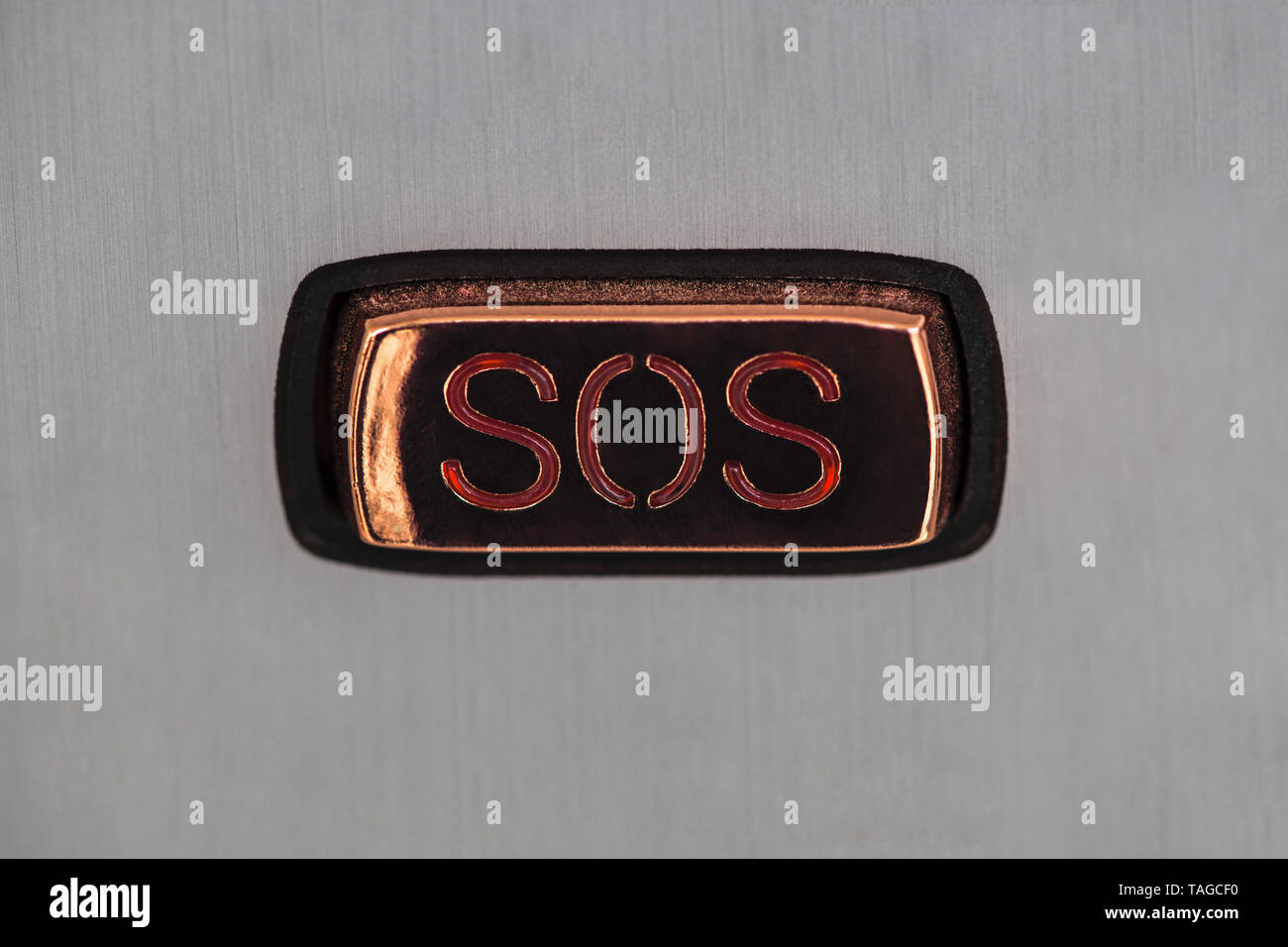 SOS button close-up on the gray metal background of the device ...