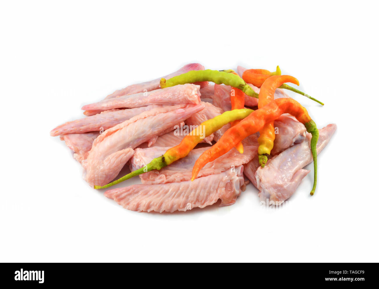 Fresh raw chicken wing and chilli isolated on white background Stock ...
