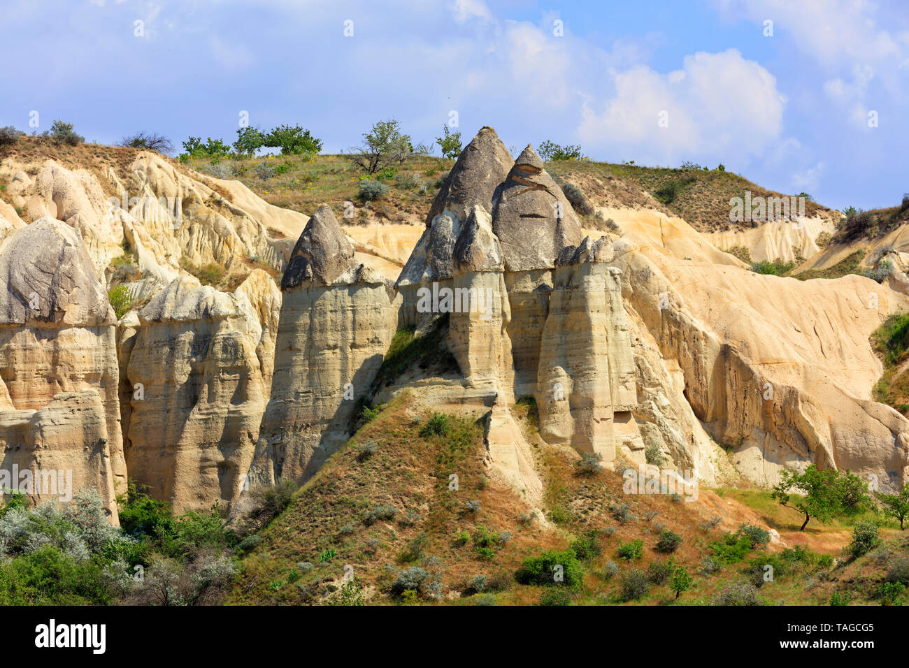 Cone-shaped cliffs of red and white sandstone in the landscape of ...
