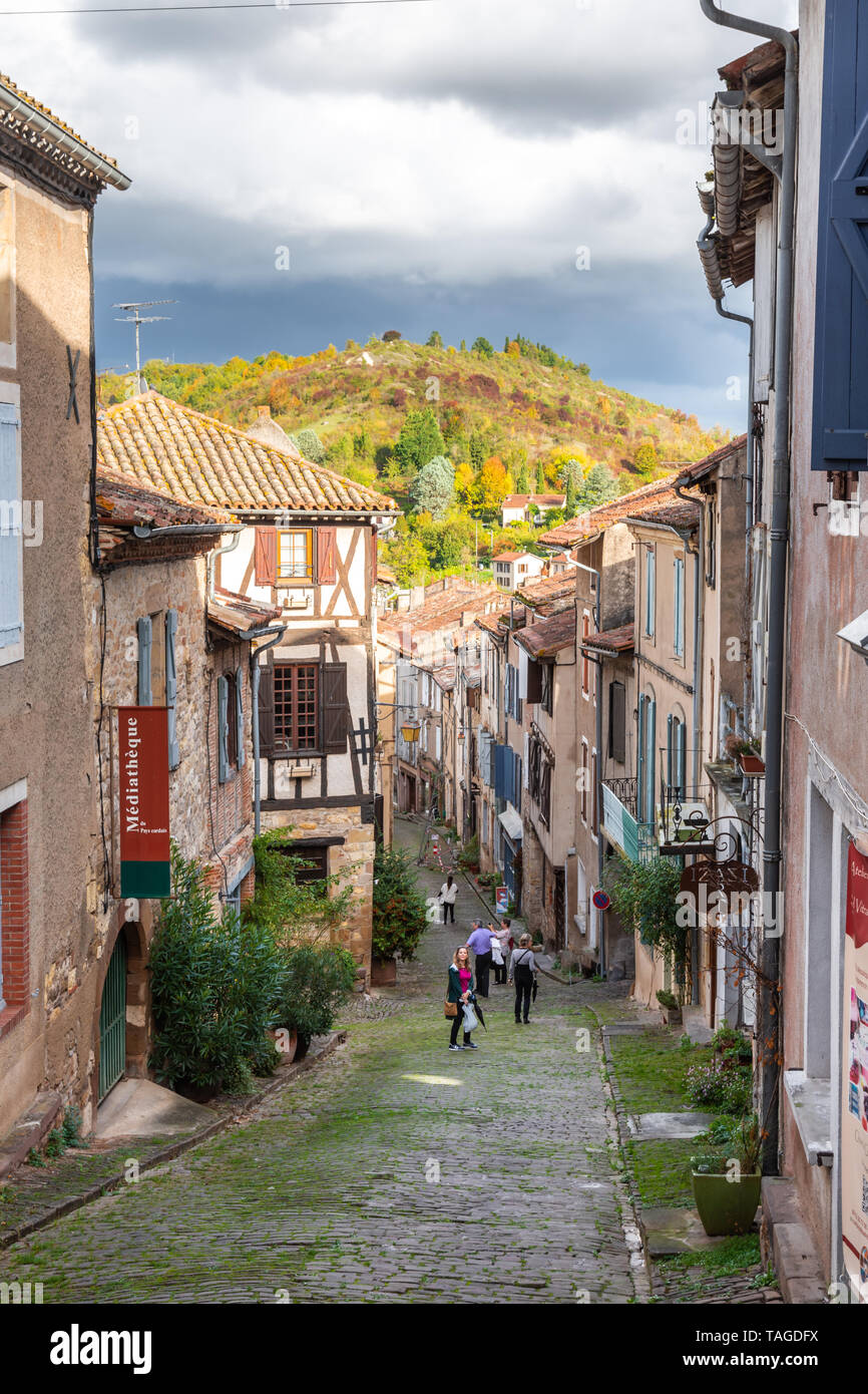 Cordes-sur-Ciel, Tarn, France - 3 October 2017: Old cobblestone street ...