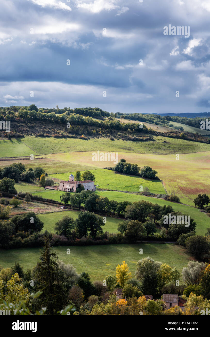 Rustic farmhouse and rural landscape in regional France with overcast ...