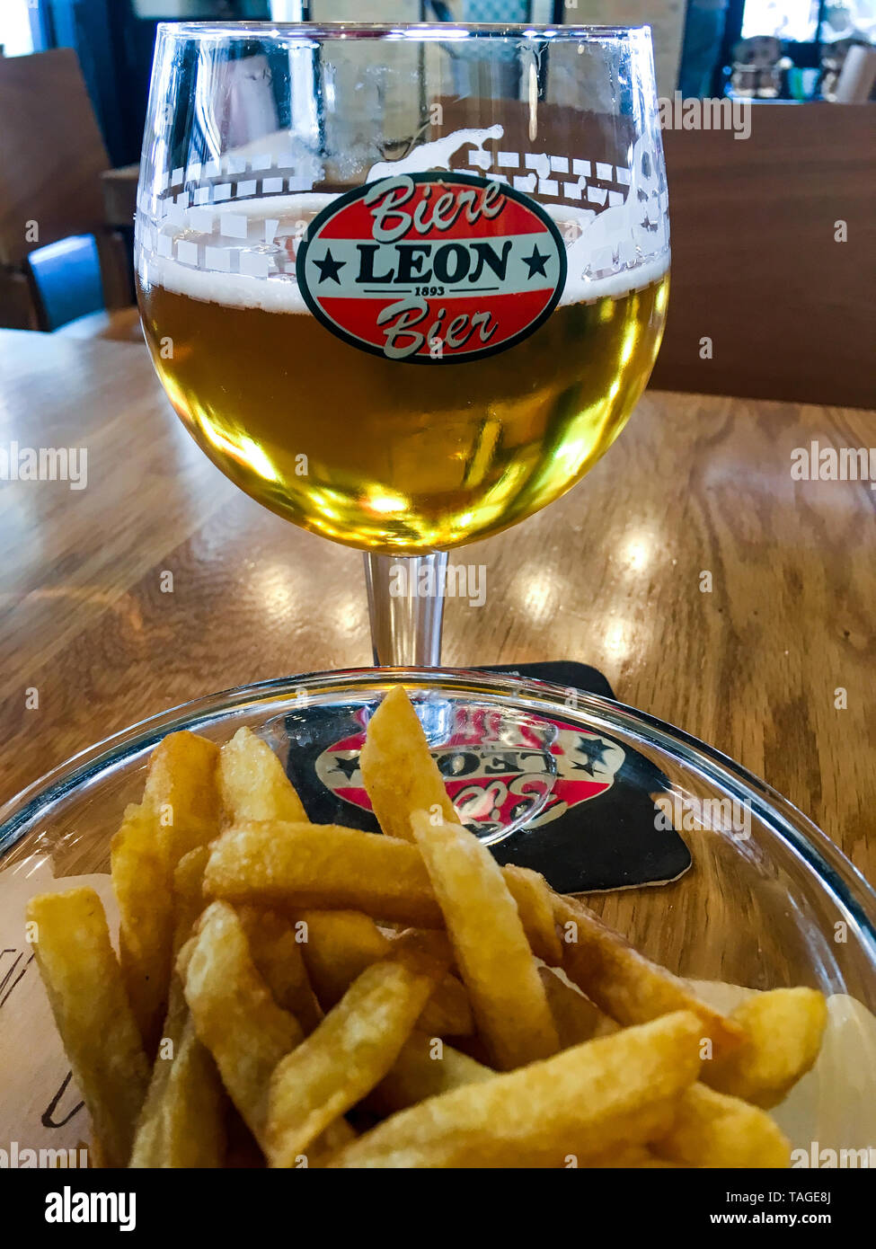 Beer and fries, Leon de B. restaurant, Lyon, France Stock Photo - Alamy
