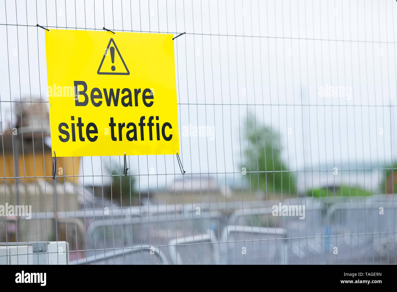 Beware construction site traffic sign on fence Stock Photo - Alamy