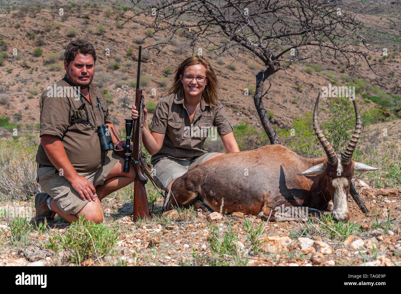 Hunters pose with their animal trophy on a game farm in Namibia Stock ...