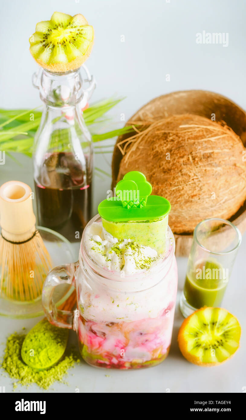 Vegan Matcha fusion drink with matcha ice cream in glass jar and ...