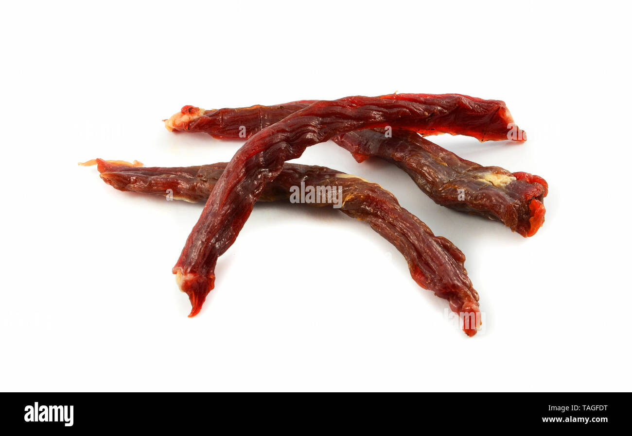 Long sliced of dried meat beef jerky isolated on white background Stock ...