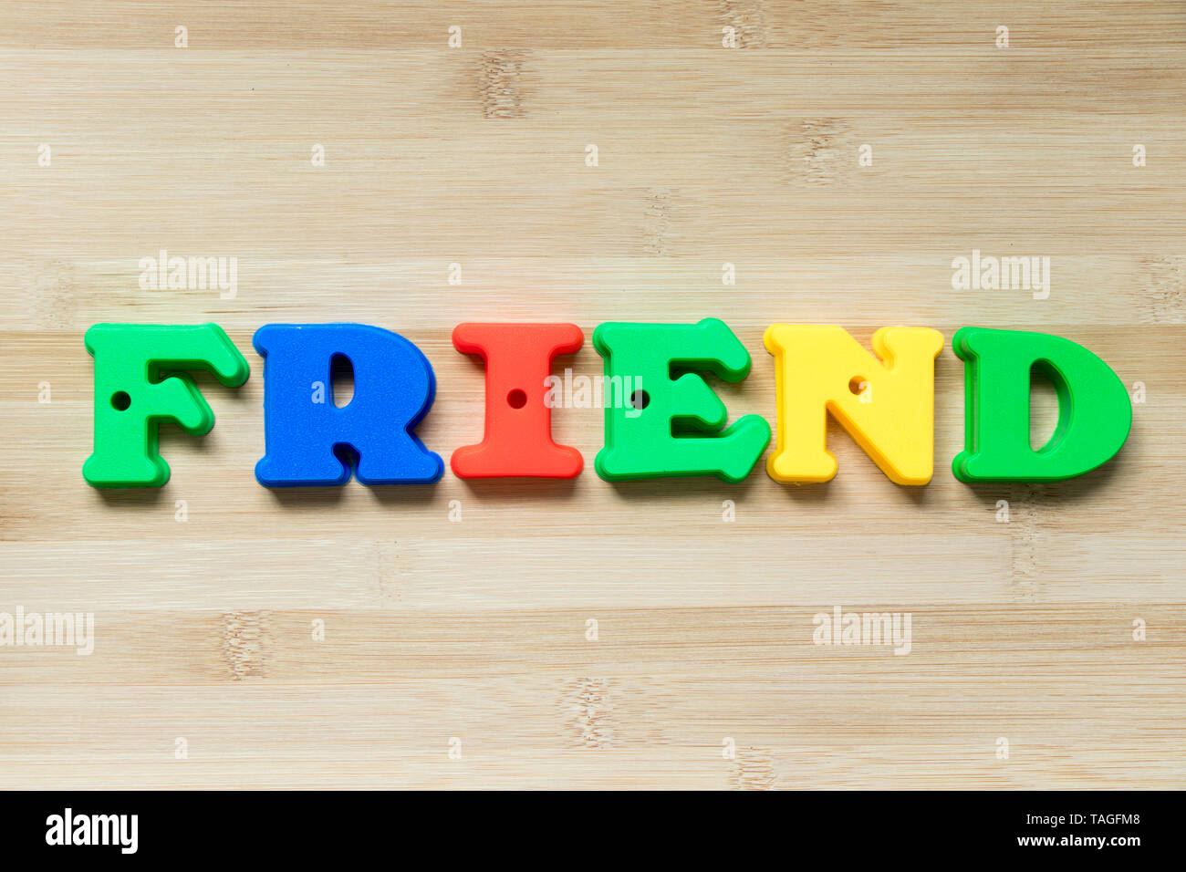 Color plastic alphabet in word friend on wood background Stock Photo ...