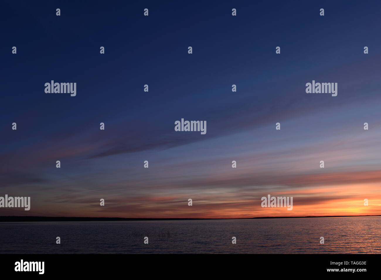 romantic sky at sunset blue in the twilight glow over the lake Stock ...