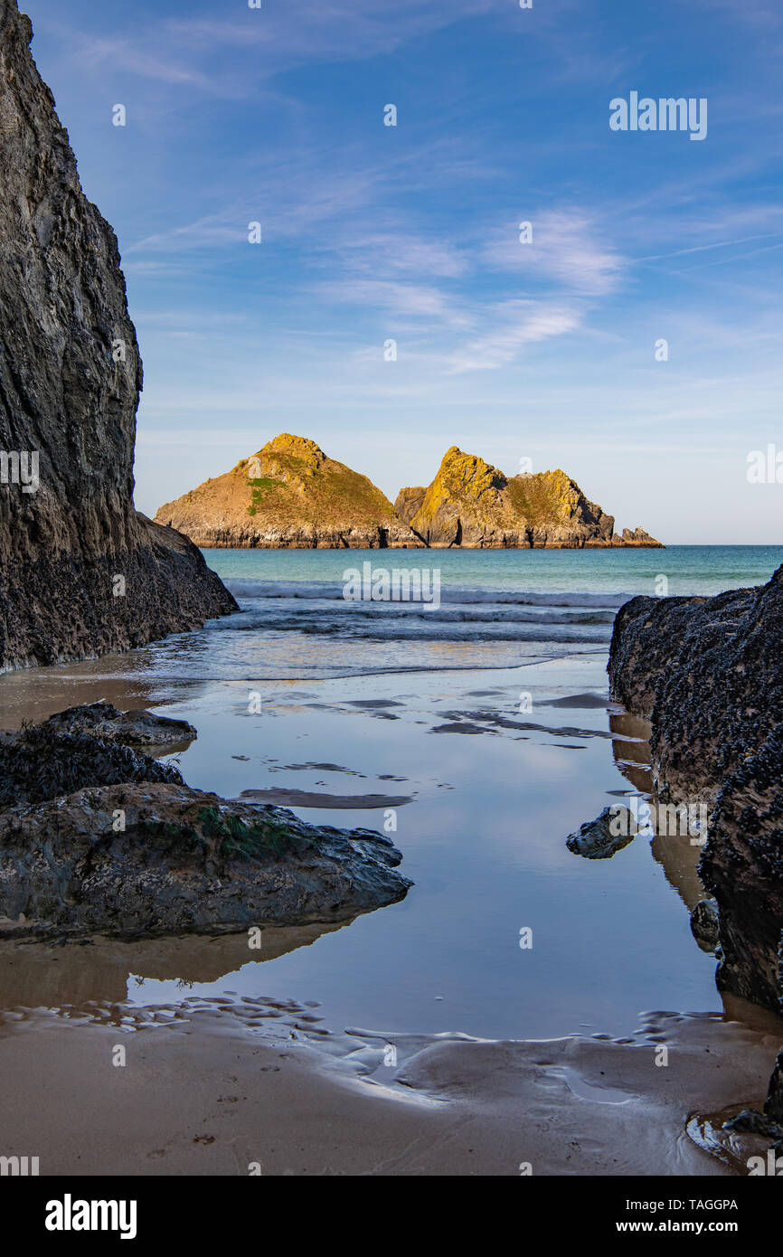 view out through inlet to sea over the poldark rocks, Holywell Bay ...