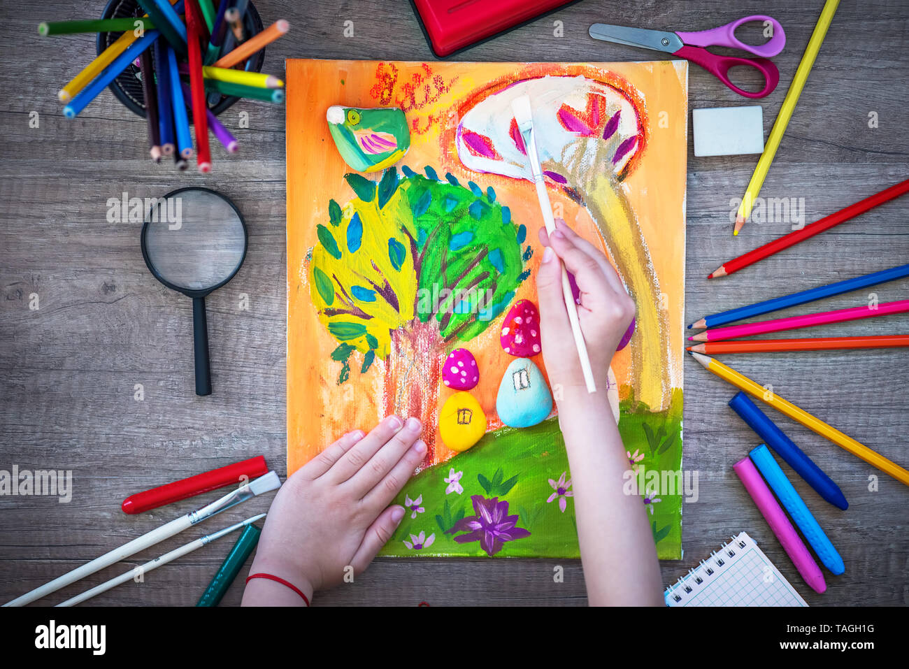 Top view of little girl painting Stock Photo - Alamy
