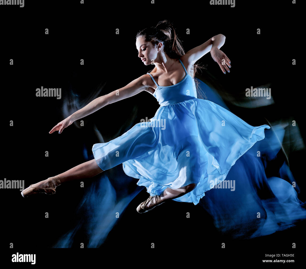 one caucasian young woman ballet dancer dancing isolated on black ...