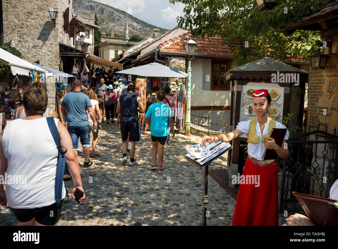 MOSTAR, BOSNIA AND HERZEGOVINA - AUGUST 05, 2015: A girl dressed in ...