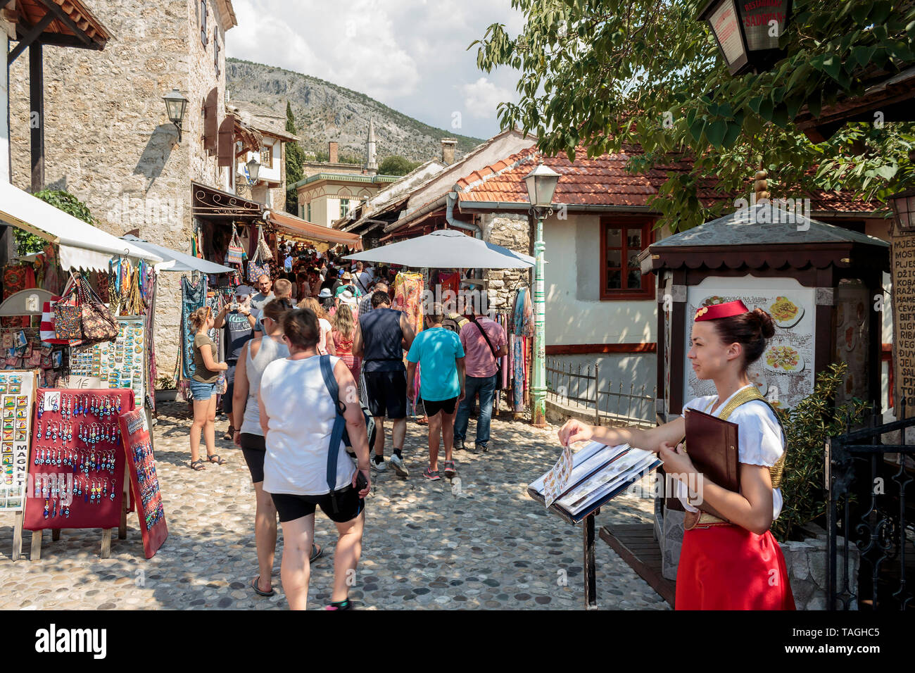 MOSTAR, BOSNIA AND HERZEGOVINA - AUGUST 05, 2015: A girl dressed in ...