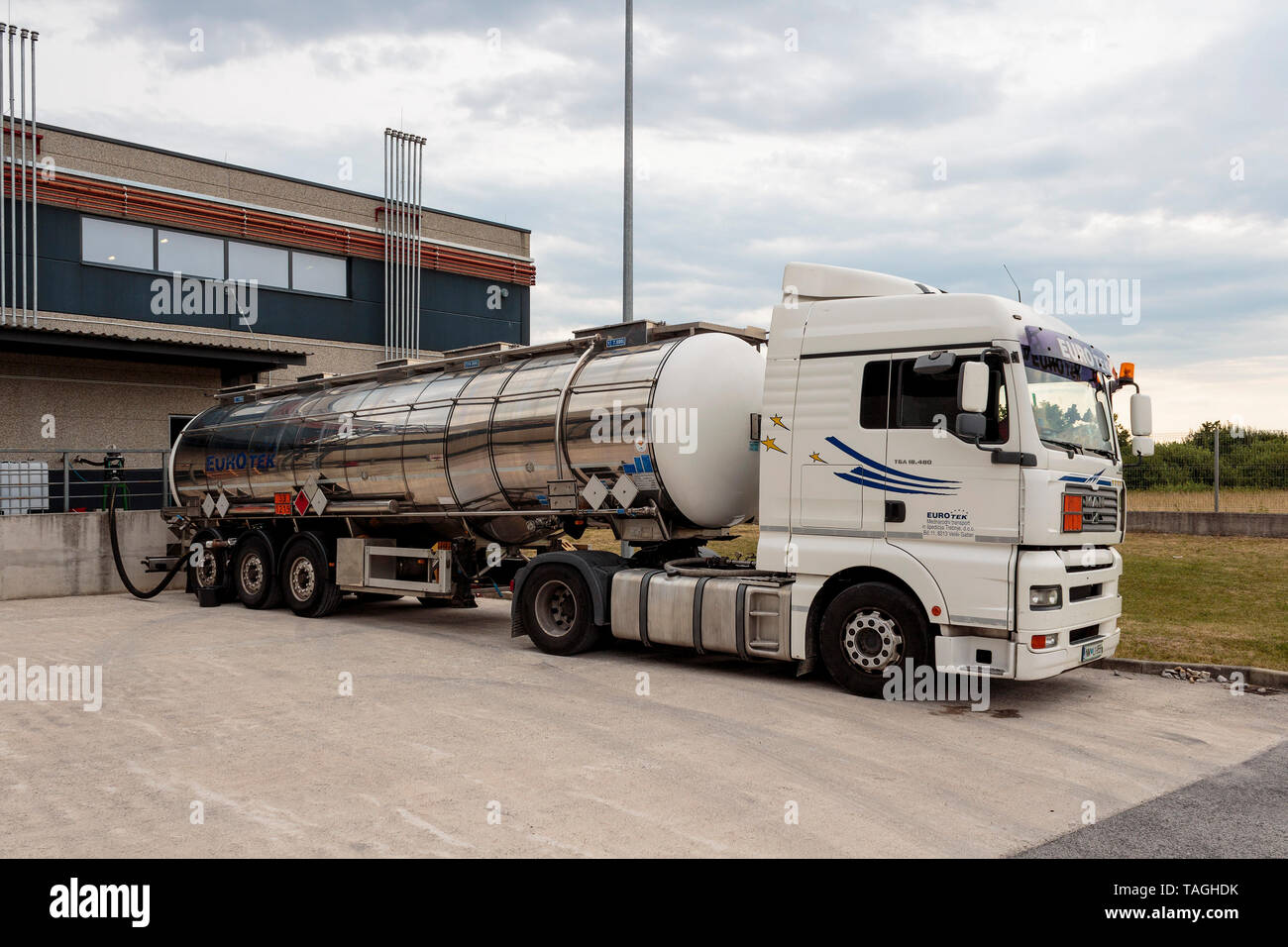 ZAGREB, CROATIA - JUNE 23, 2015: Tank truck unloading dangerous ...