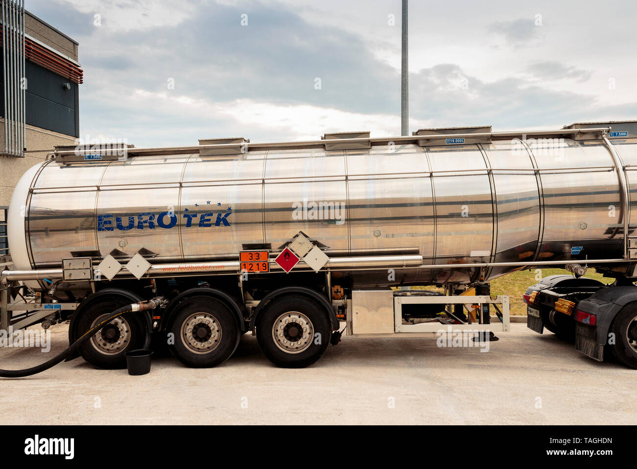 ZAGREB, CROATIA - JUNE 23, 2015: Tank truck unloading dangerous ...