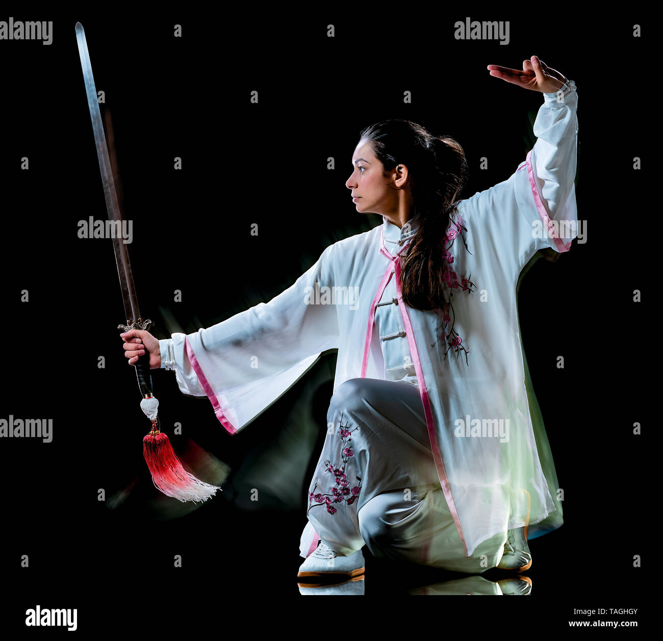 one chinese woman partacticing Tai Chi Chuan Tadjiquan posture studio ...