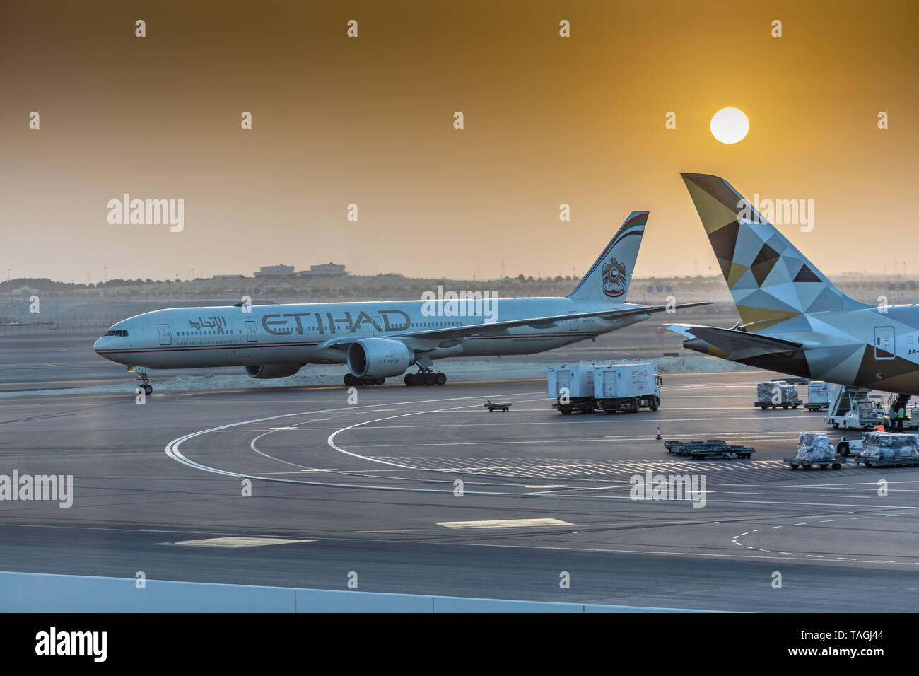 Etihad Airport Morning Sunrise with Airplanes Stock Photo - Alamy