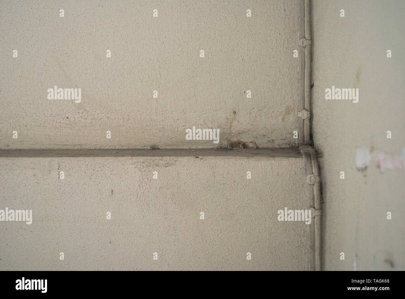 Wiring in buildings By placing along the edge of the wall Stock Photo ...