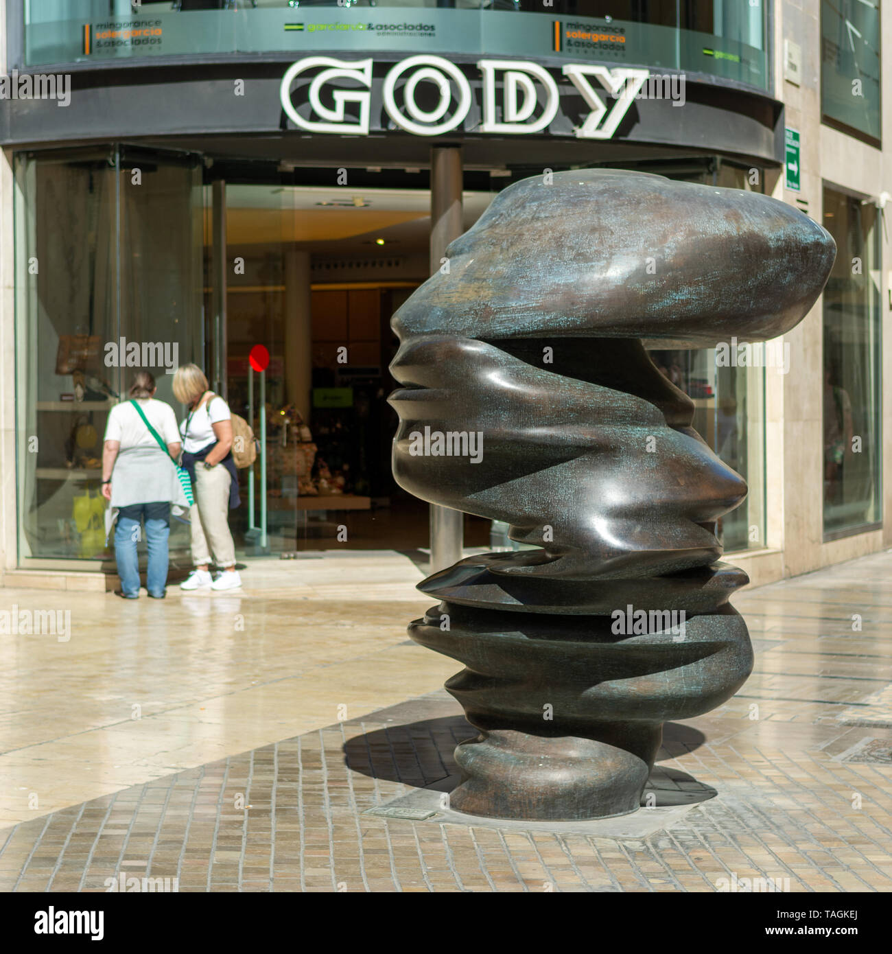 Modern head and face shaped sculpture outside a Gody store on the ...