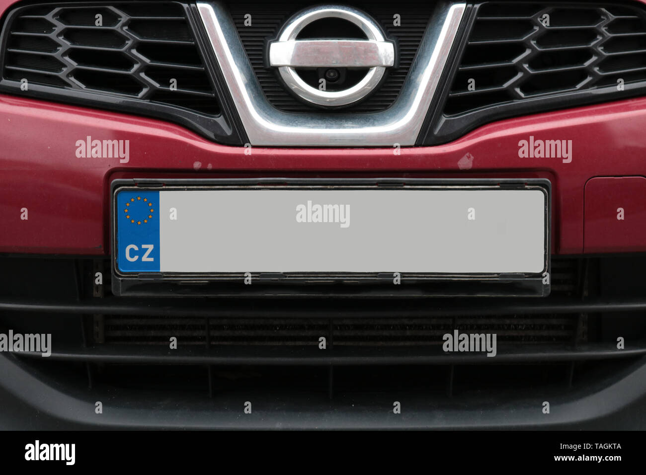 Empty License plate in the front of a red car Stock Photo - Alamy