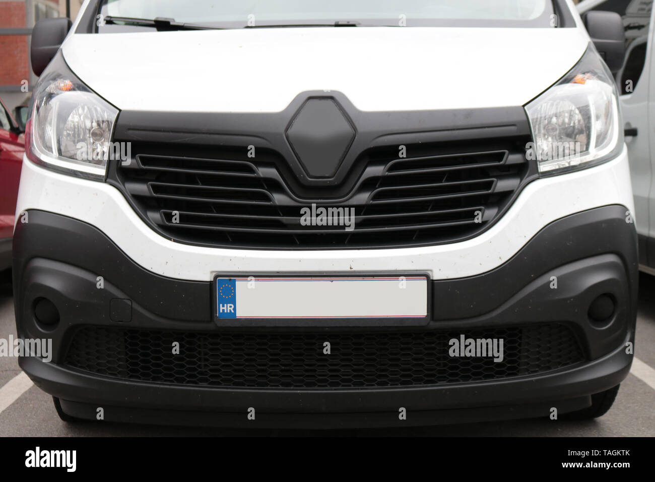Empty License plate in the front of a white car Stock Photo - Alamy