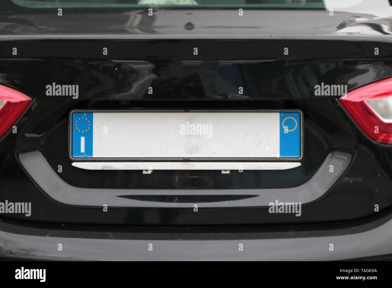 Empty License plate on the back of a black car Stock Photo - Alamy