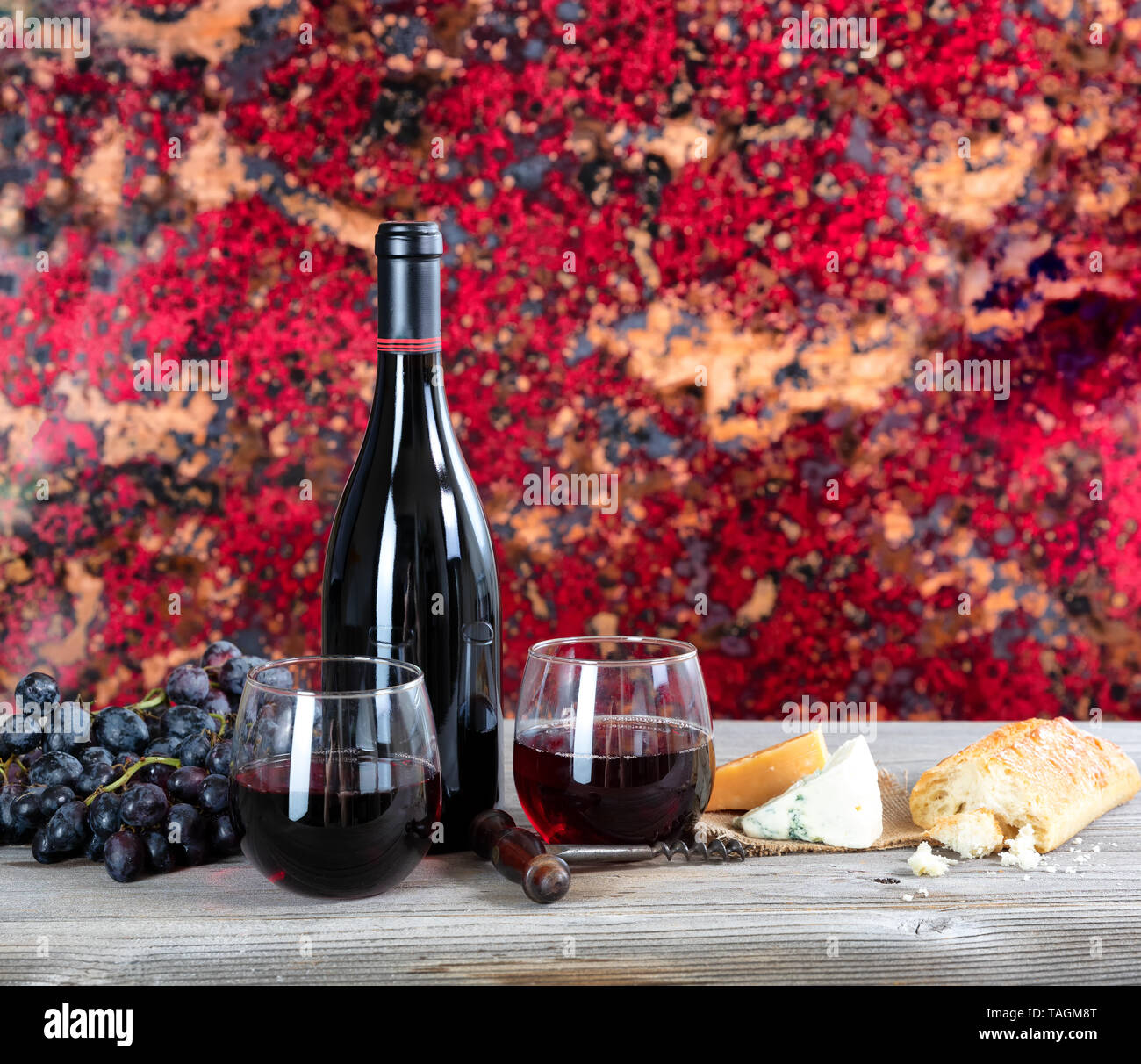Red wine with cheese and bread on rustic wooden table Stock Photo - Alamy