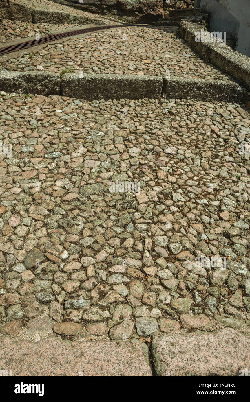 Stone pavement in pathway with stairs, forming a singular background at ...