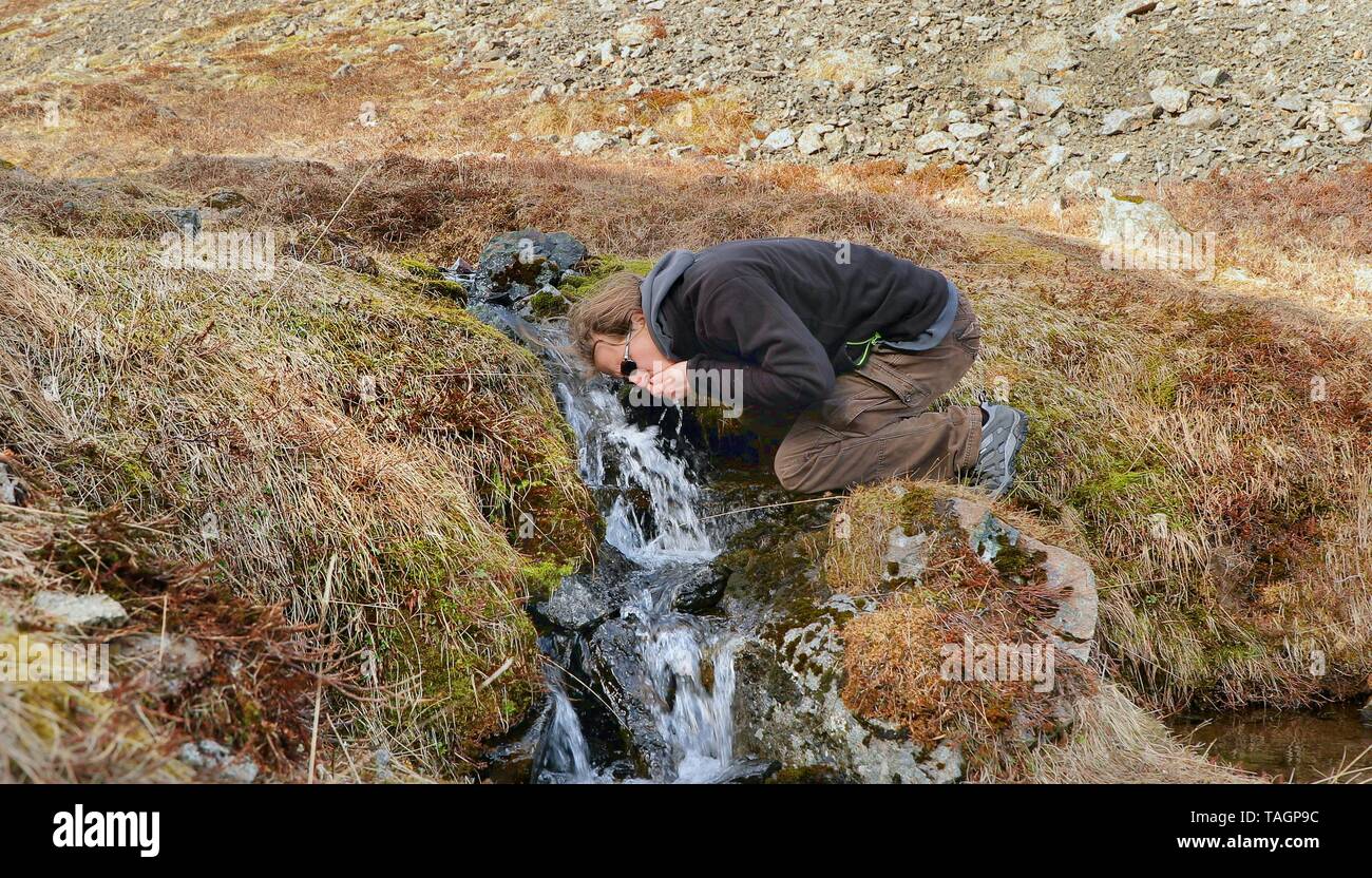 Man drinking water from river hi-res stock photography and images - Alamy