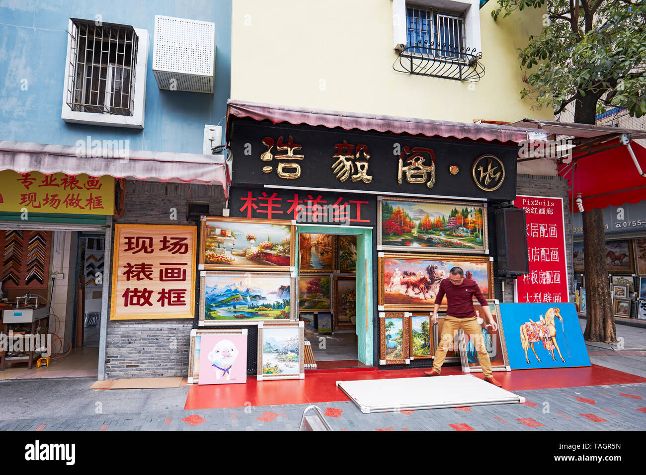 Local art gallery with paintings displayed outside. Dafen Oil Painting ...