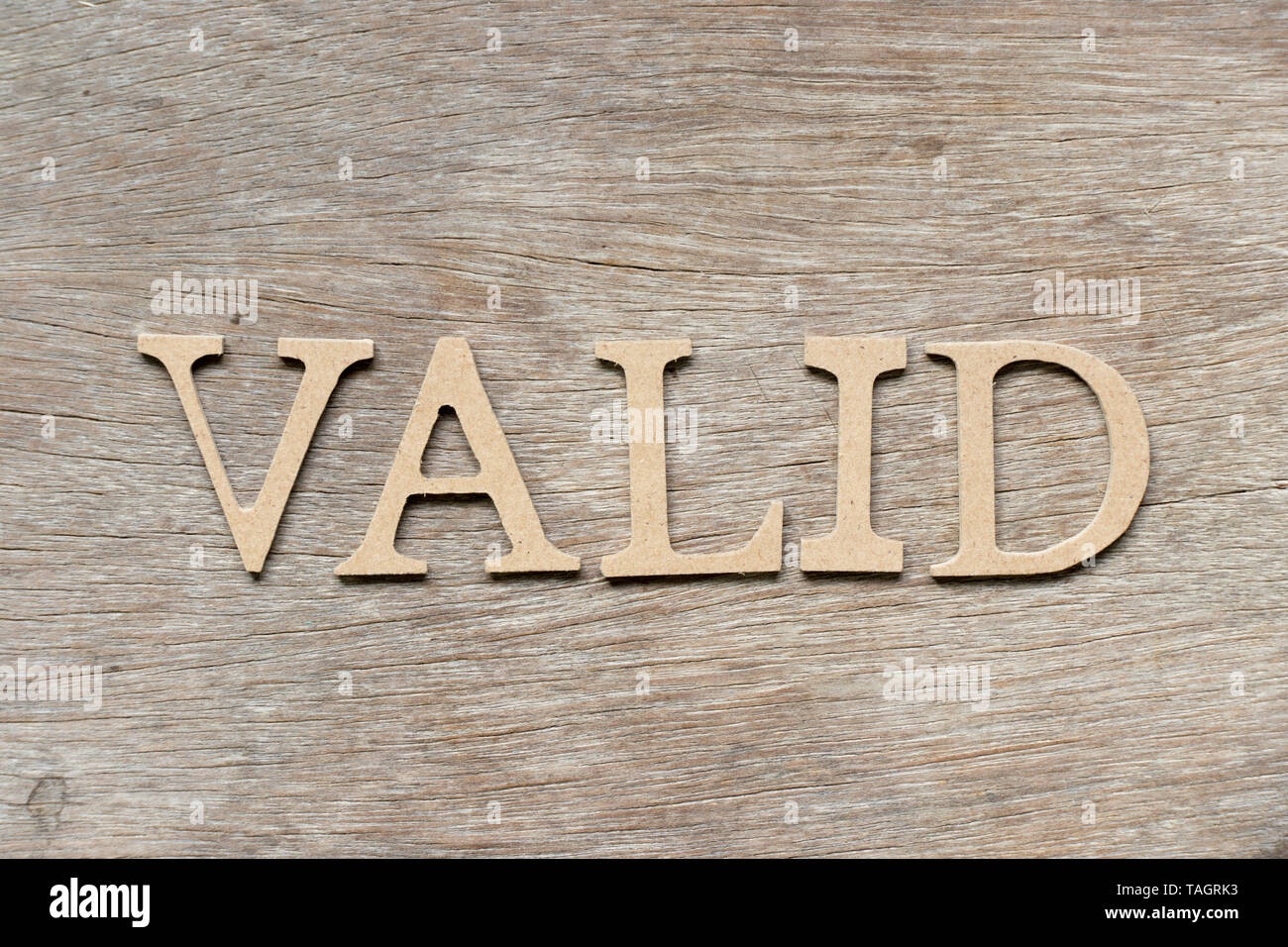 Alphabet letter in word valid on wood background Stock Photo - Alamy