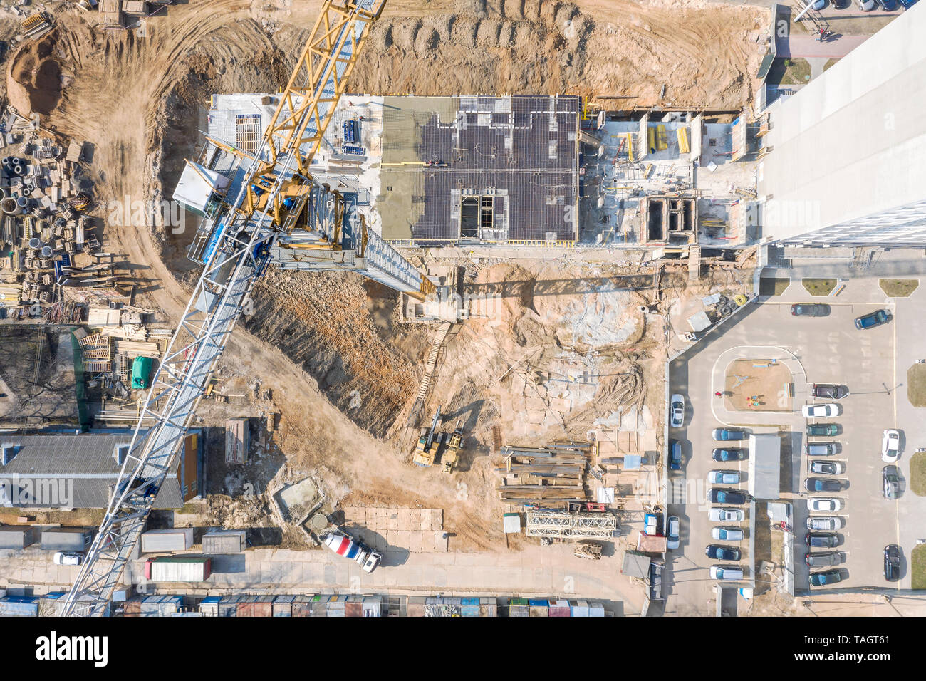 aerial top view of city building under construction and high tower ...