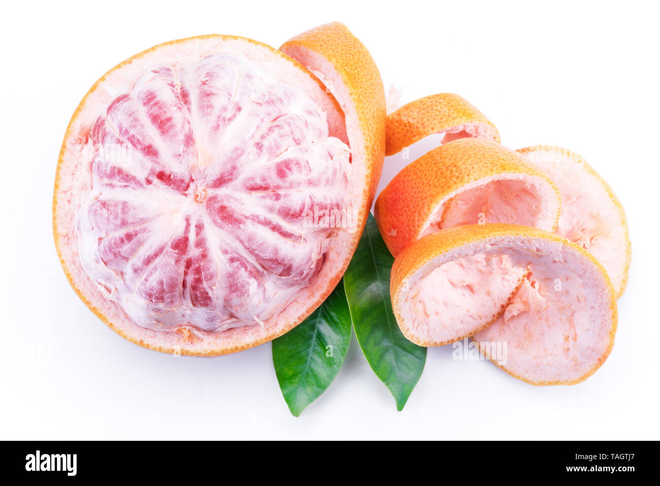 Peeled grapefruit with green leaves isolated on white background Stock ...