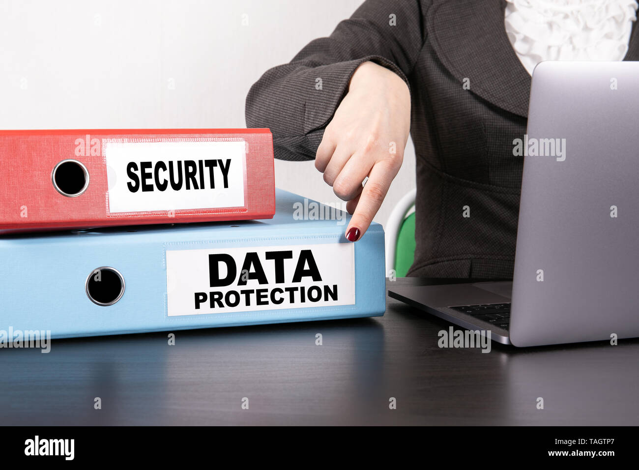 Data protection and security concept. Two binders on desk in the office ...