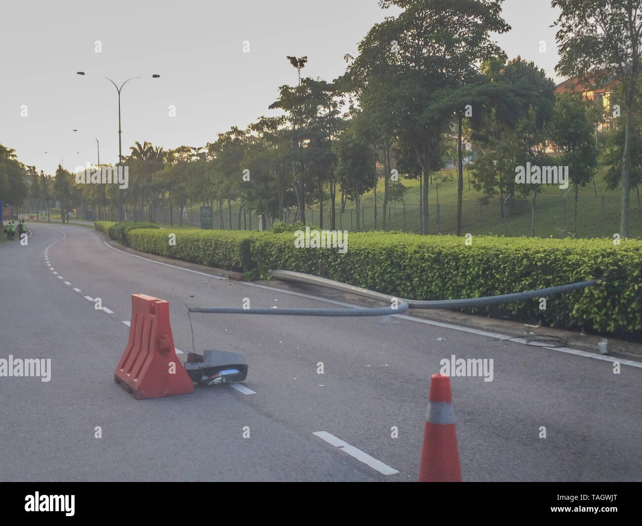 Fallen streetlight on a dual carriageway in Malaysia Stock Photo - Alamy