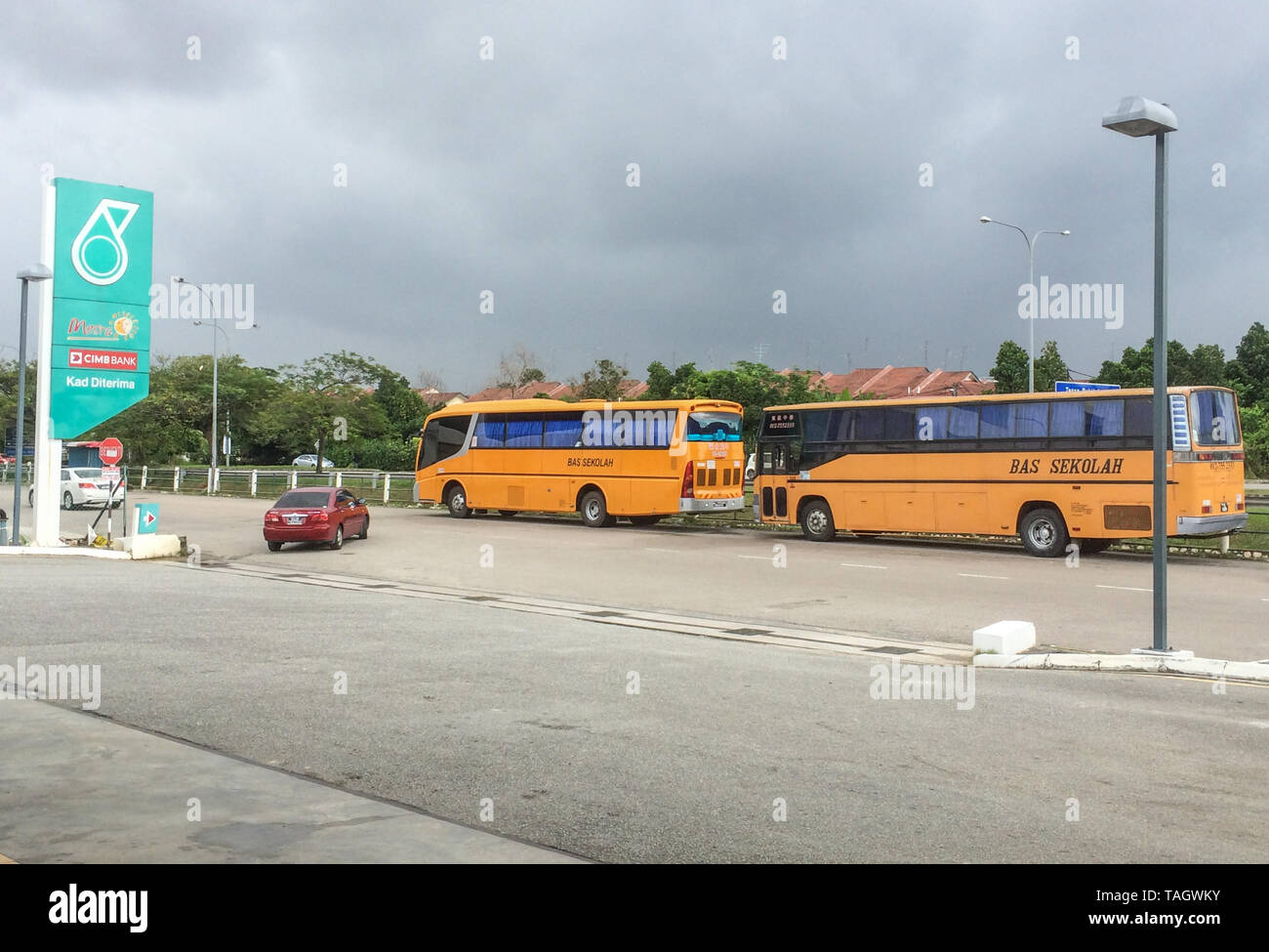 School buses parked outside a petrol station Stock Photo - Alamy