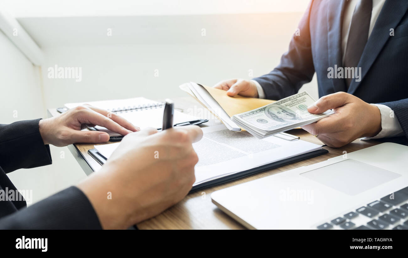 bribe and corruption concept, Corrupted businessman sealing the deal ...