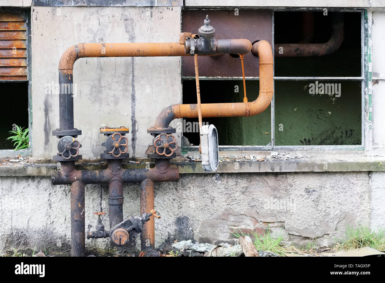 Pipework arrangement with valves left rusty and dirty Stock Photo - Alamy