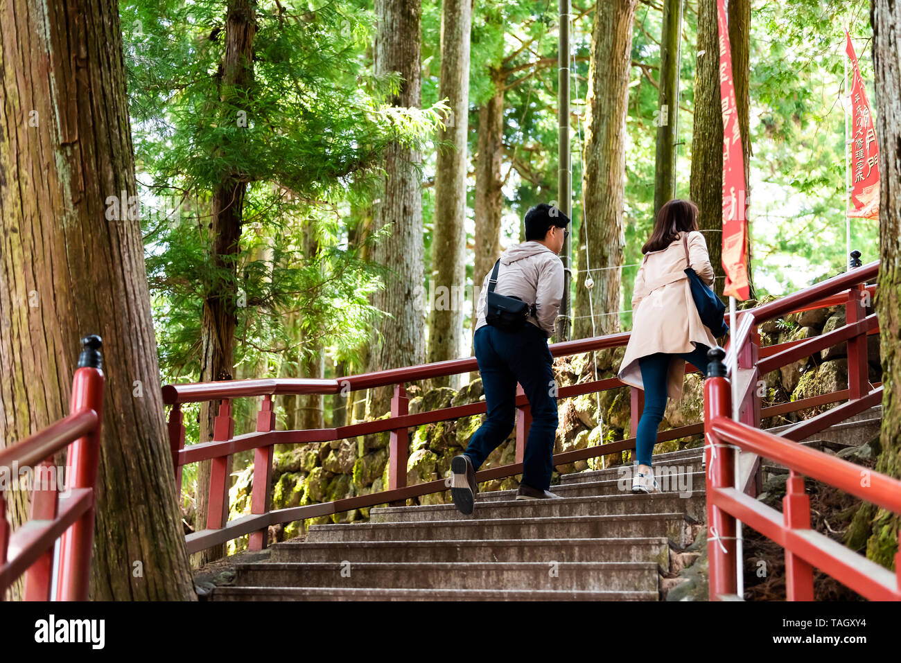 Nikko, Japan - April 4, 2019: Couple tourists walking on red railing ...