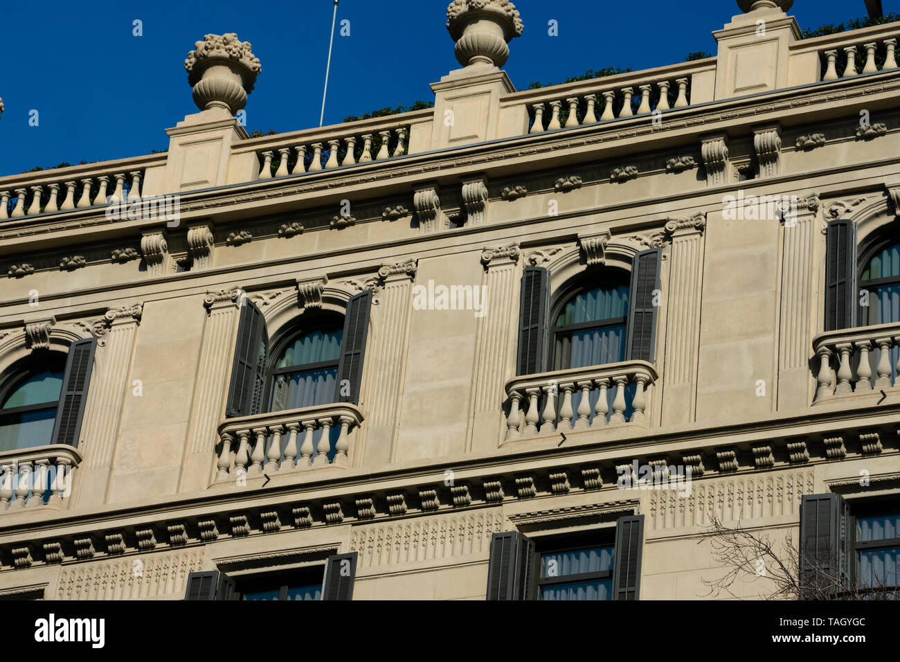 Barcelona, Spain. February 9, 2019. Old building facade and balconies ...
