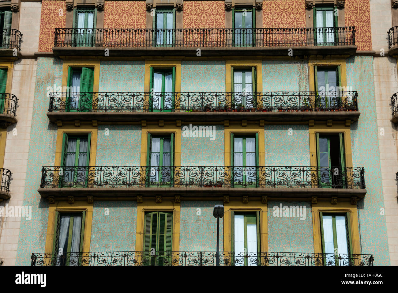 Barcelona, Spain. February 10, 2019. Old building facade and balconies ...