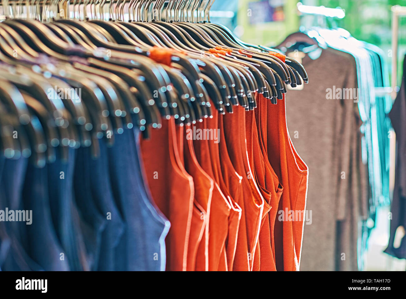Fashion trend concept. Interior of clothes store with different women ...