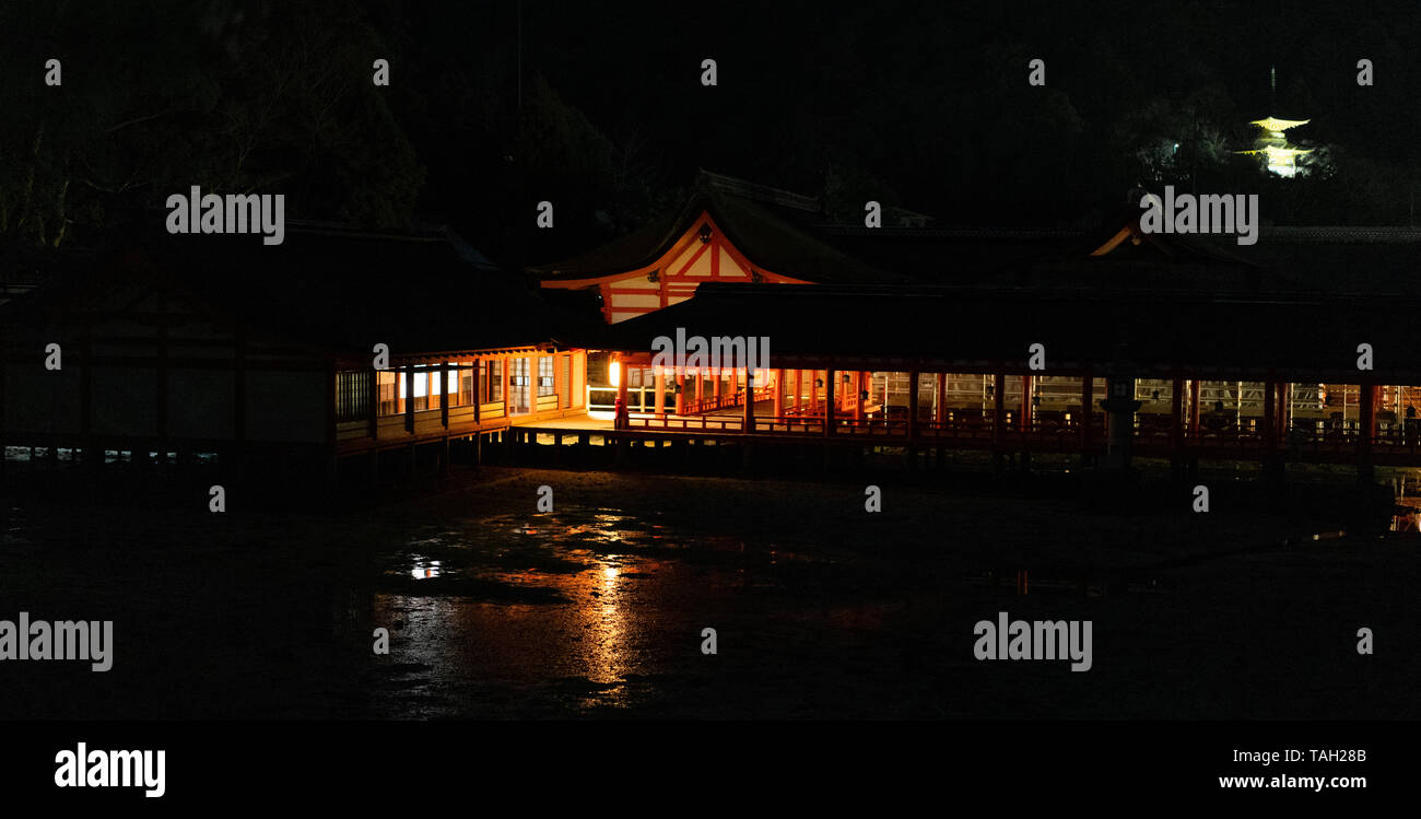 Itsukushima shrine, Miyajima, Japan on the falling back tide at night ...
