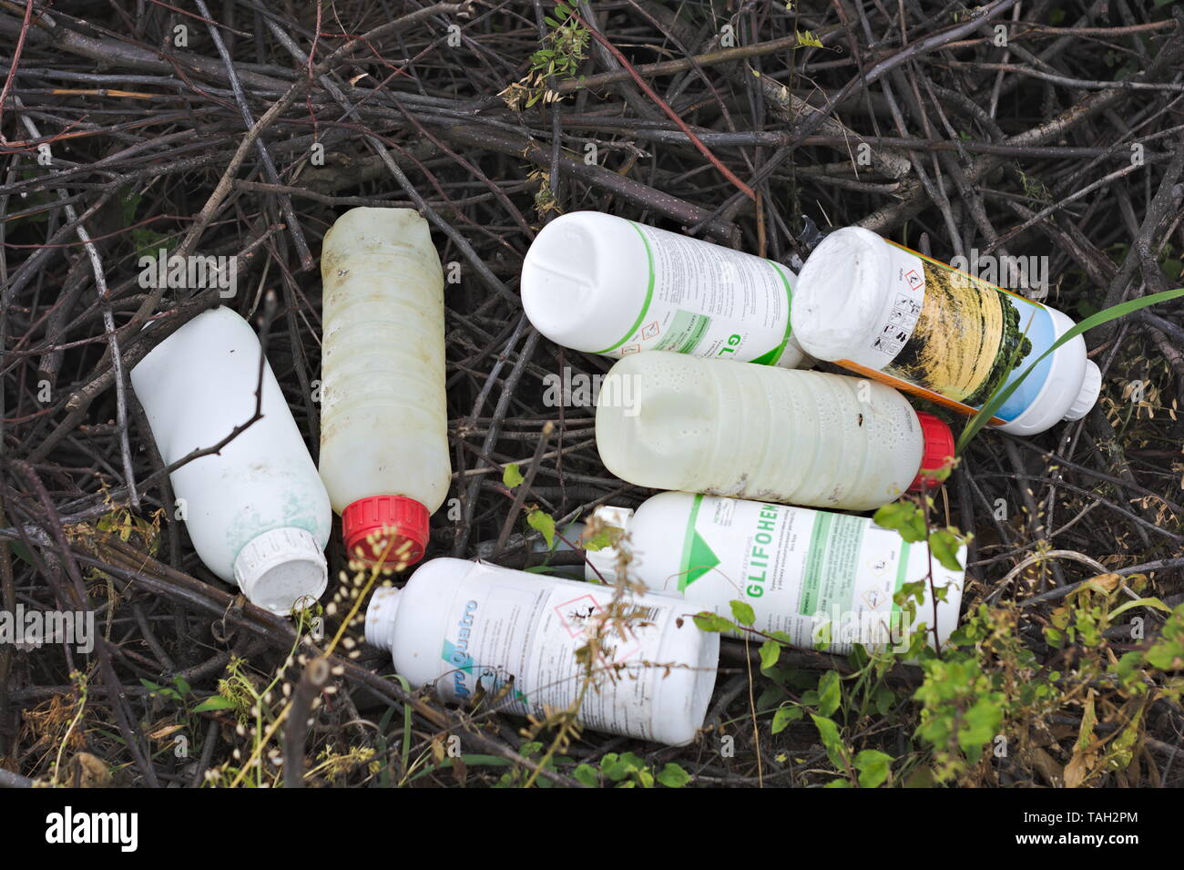 Pollution by improper disposal of chemical packaging Stock Photo - Alamy