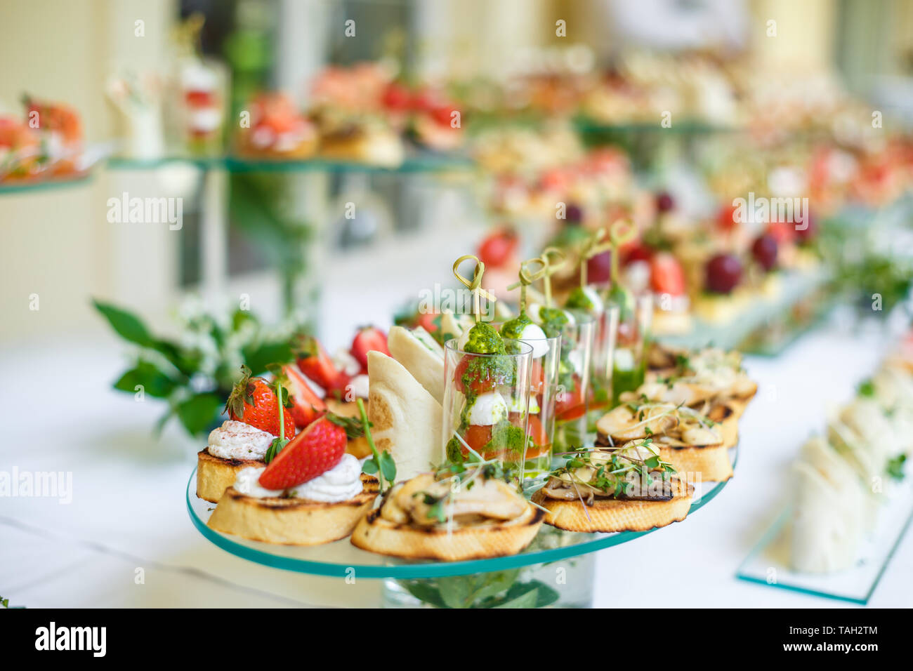Catering. Off-site food. Buffet table with various canapes, sandwiches ...