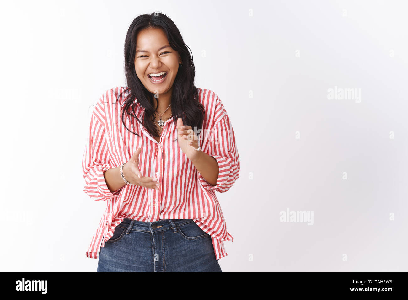 Girl laughing over hilarious joke applausing and giggling from fun and ...