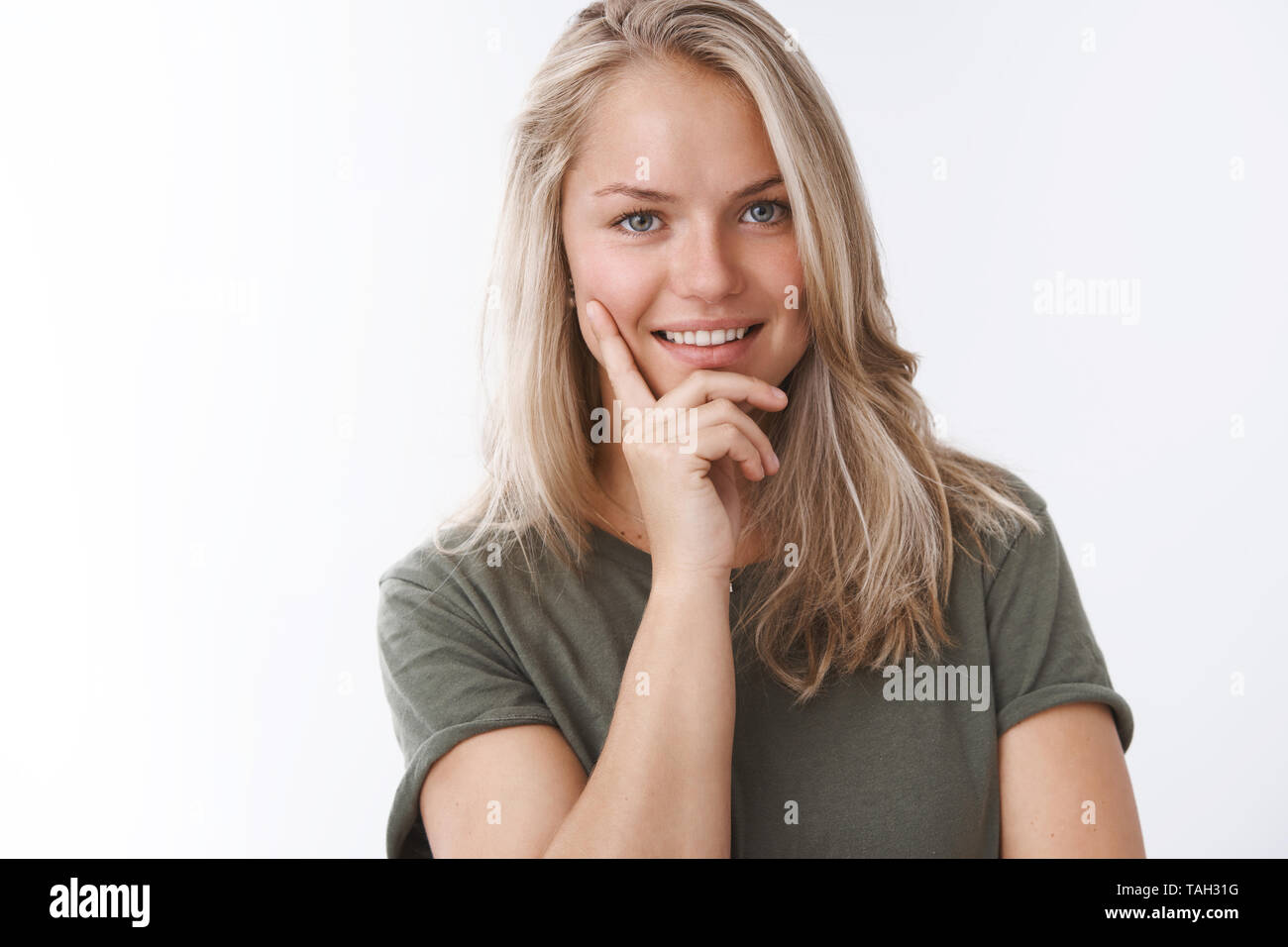 Close-up shot of powerful self-assured good-looking blond woman with ...
